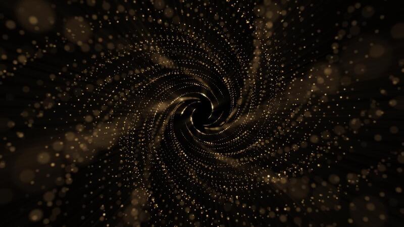 Abstract background with a spiral of glittering shiny gold particles and shallow depth of field ...