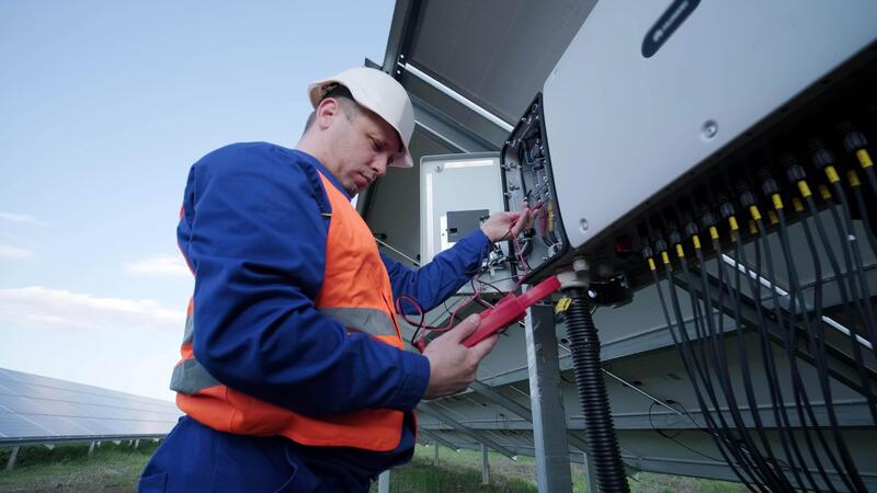The Inspector Checks The Actual Output Voltage Level Of Inverter 2