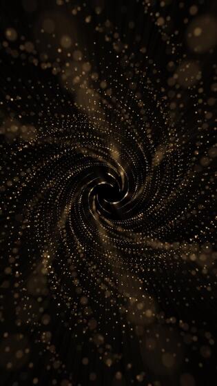Abstract background with a spiral of glittering shiny gold particles and shallow depth of field ...