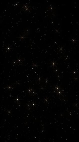 Bright shiny twinkling golden stars moving across the night sky. This glittering starry night ...