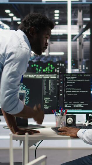 Pleased Data Center Manager Praising Work Done By Engineer Using Neural