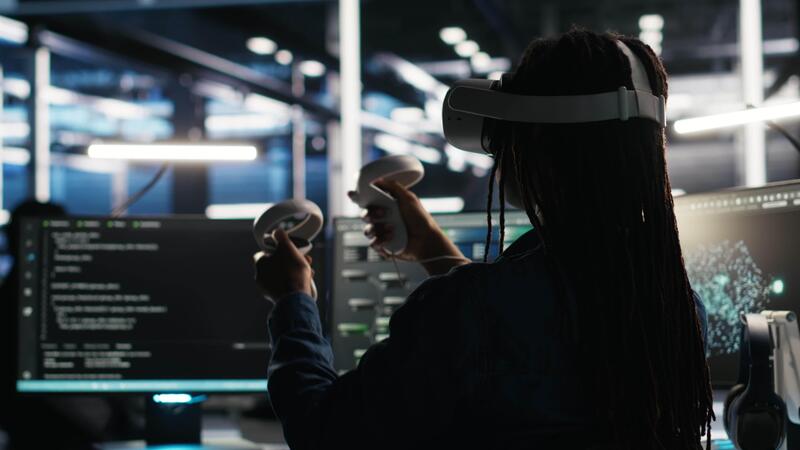 Vertical Data center technician using virtual reality tech and node tree software to analyze ...