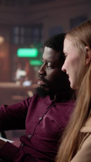 Vertical Group of diverse pupils engaging in online course via call, participating at the remote ...