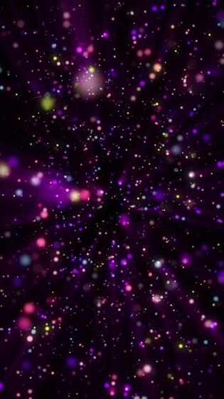 Abstract particle background with glittering shiny colorful particles and shimmering light beams ...