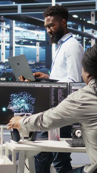 Vertical Portrait Of Cheerful Data Center Engineer Analyzing Gear