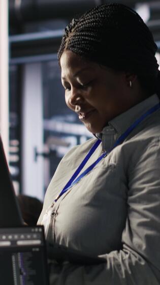 Vertical Data center manager supervising engineer developing software ...