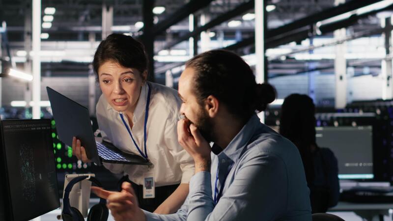 Programmers Doing Brainstorming In Server Room Reviewing Neural
