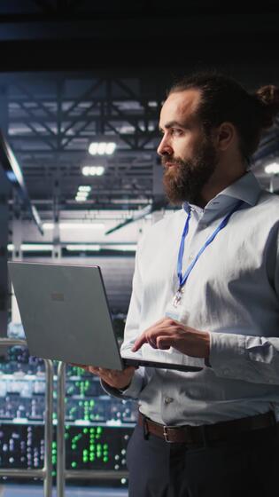 Vertical Computer Scientists On Data Center Industrial Platform Analyzing Performance Outputs On