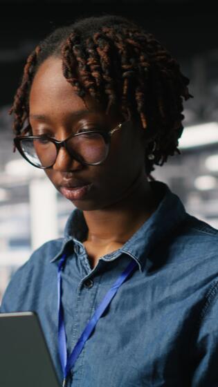 Vertical System Administrators On Data Center Industrial Platform Analyzing Performance Outputs