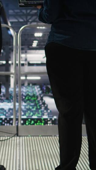 Vertical Data Center Manager Overseeing Work Done By Admin Using Neural