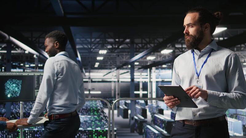 Server Room Technician Next To Coworkers Reviewing Neural Network Code And Llm Visualization