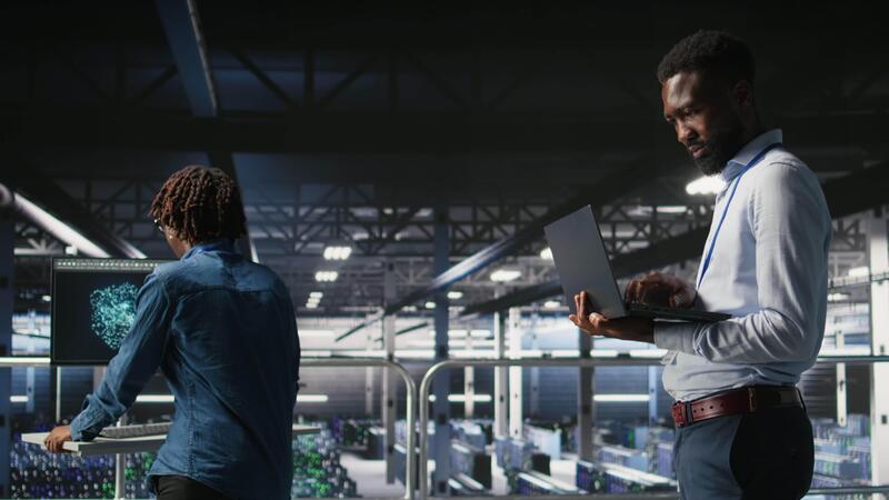 IT experts on data center industrial platform pleased by neural network outputs after completing ...