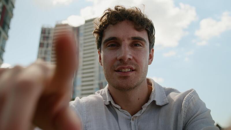 Caucasian man smiling pov scrolling internet guy social media tapping using mobile phone ...