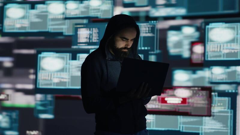 Conceptual representation of cyber crime with male hacker exploiting system vulnerability, using ...