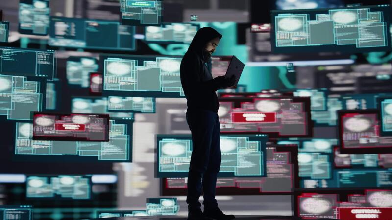 Conceptual representation of cyber crime with male hacker exploiting system vulnerability, using ...