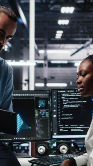 Vertical Data center engineering team members collaborating on neural ...