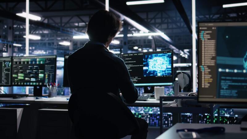 Admin in server room drinks coffee while using AI to review infrastructure diagnostics. IT ...